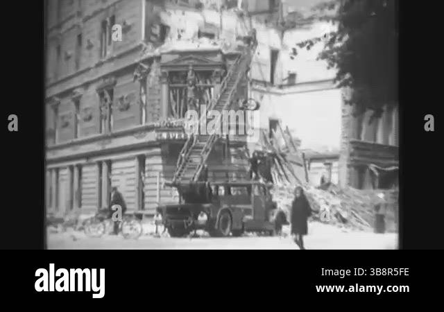 GERMANY - 1945 - A wrecking crew demolishes unsafe buildings under the ...