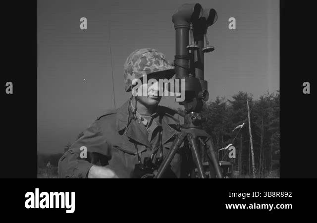 USA - 1948 - A soldier uses a spotting system during the artillery fire ...