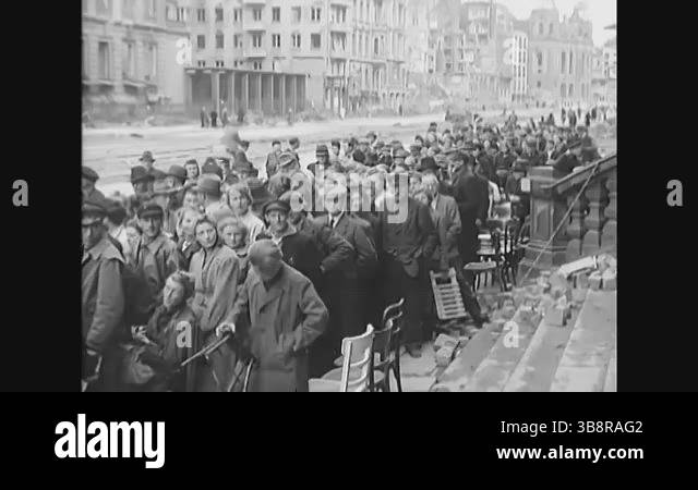 GERMANY - 1945 - German civilians wait in line outside to enter ...