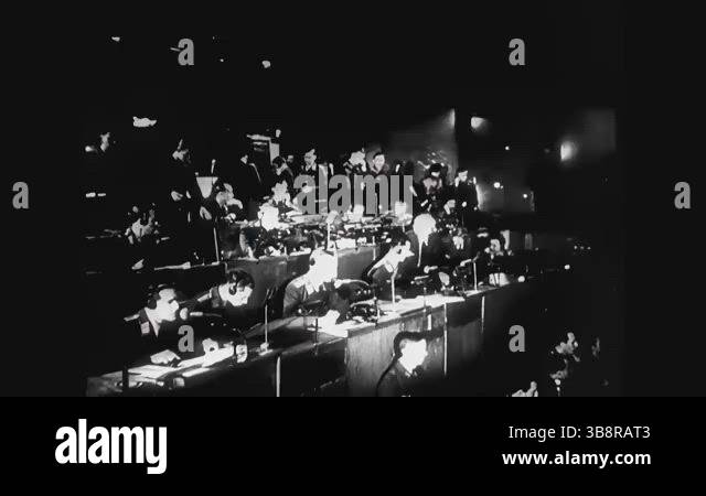 GERMANY - 1940s - Many Germans gather at plotting tables and boards ...