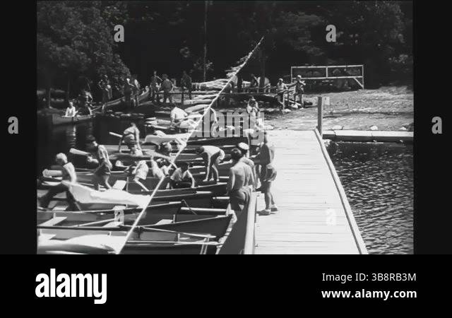 MICHIGAN - 1937 - Young scouts go boat racing in the water at Camp ...