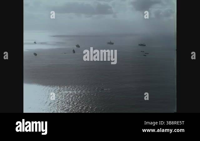USA - 1961 - Several warships and boats are seen in formation on the ...