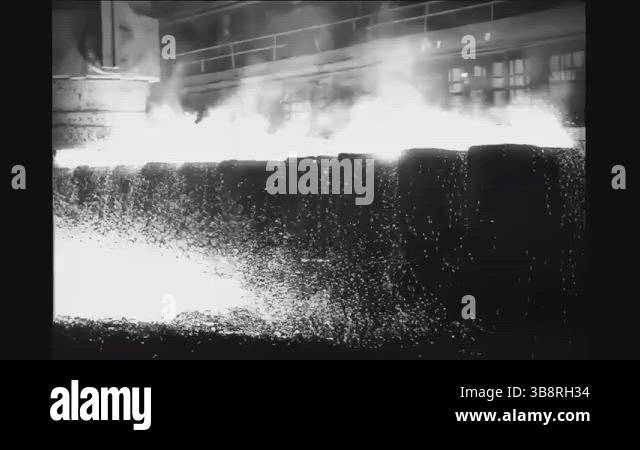 MICHIGAN - 1952 - Close-ups of steel workers show a huge crane removing ...
