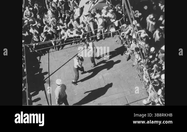 VANUATU - 1944 - A lively boxing match takes place on the deck of a ...