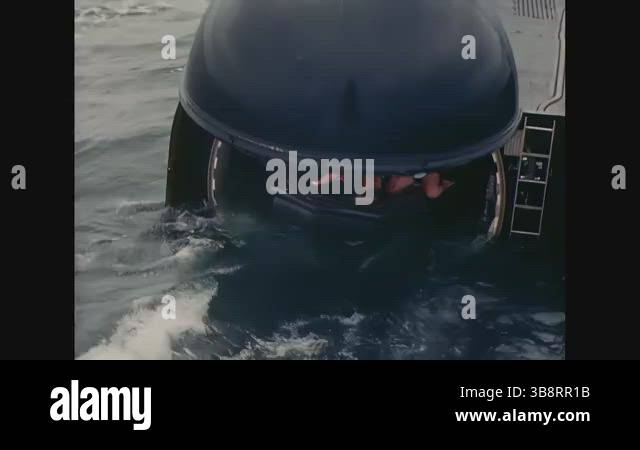 USA - 1970 - The submarine closes its gate when divers reach inside the Amphibious Transport ...