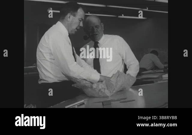 OKLAHOMA CITY - 1956 - A boss smoking a pipe tells his employee about ...