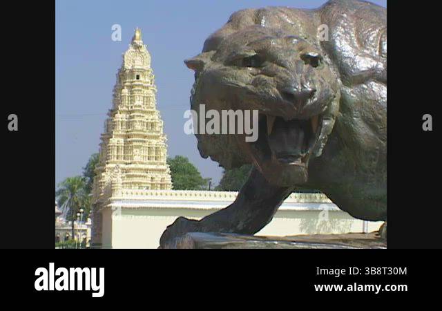 INDIA - 1999 - Close-up of a bronze tiger statue standing outside a ...