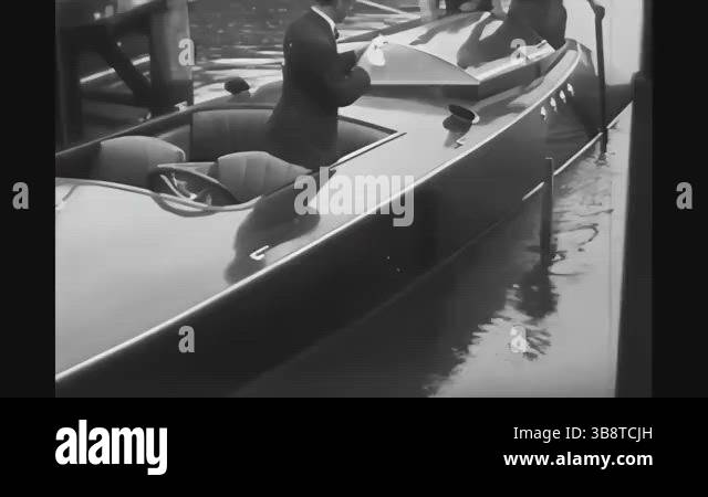 USA - 1920s - Edsel Ford rides in a motorboat to the yacht where his ...