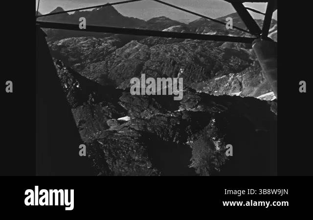 BRITISH COLUMBIA - 1940s - Aerial views of snow-capped mountains in ...