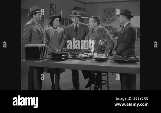 US - 1942 - in this crime film, detectives and a photographer stand ...