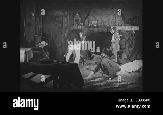 US - 1924 - in this silent western, a man wields his whip to end a fight between an intruder and ...