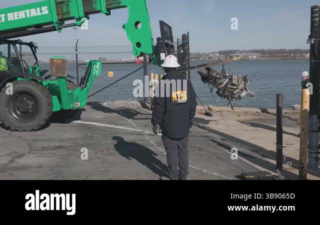 WASHINGTON DC - 2.4.2025 - NTSB and FBI investigators use a barge and ...