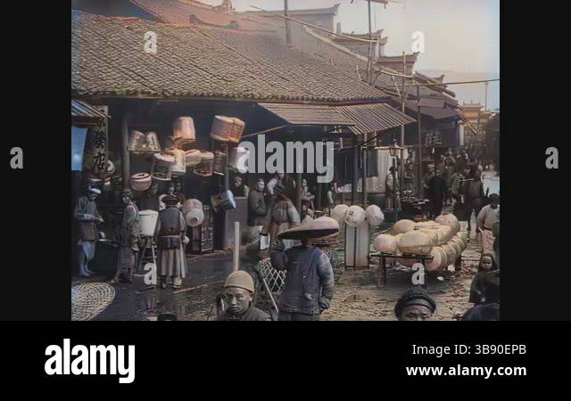 BEIJING - 1917 - Villagers walk down a busy street in Beijing, China ...