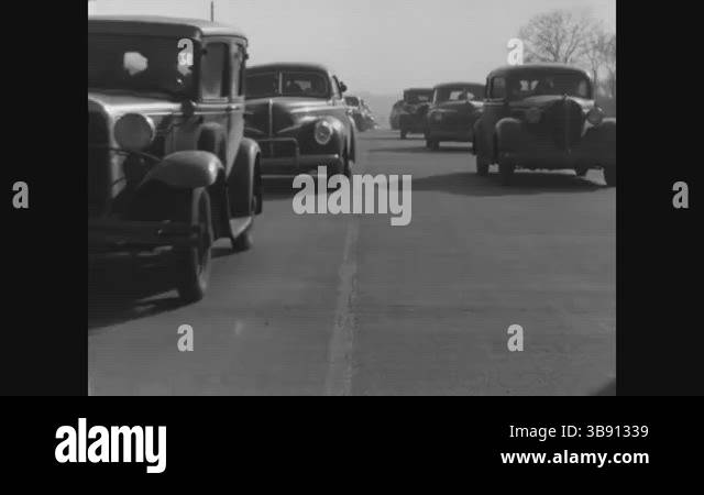 UNITED STATES - 1940s - Cars driving in two straight lines. Vehicles ...