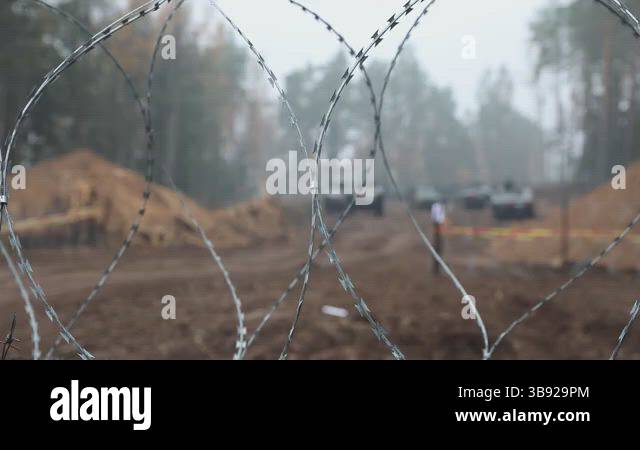 LITHUANIA - 10.26.2024 - US Army soldiers crouch in foxholes with ...