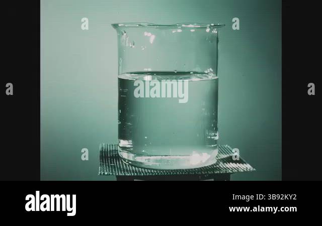 UNITED STATES - 1959 - A beaker containing ammonia. A man adds ...