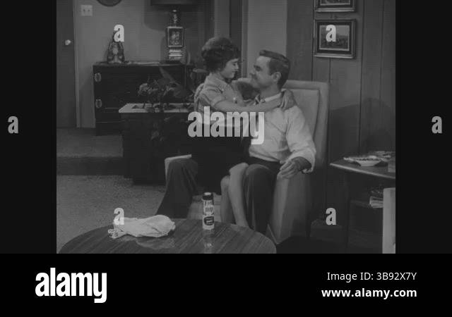 US - 1961 - in this comedy, a woman sits on her husband's lap. He ...