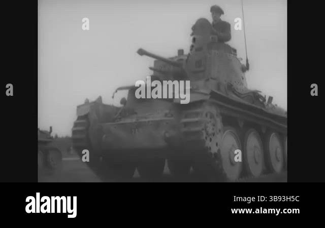 SWEDEN - 1944 - Swedish army tanks move along an open field ...