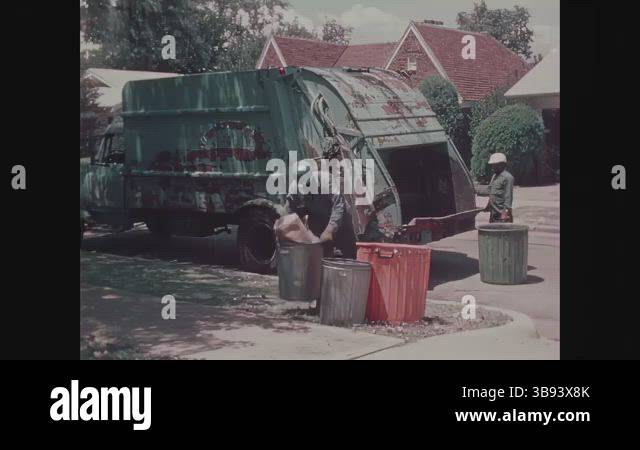 UNITED STATES - 1972 - Garbage collectors collect garbage from a ...