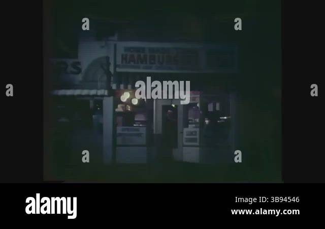 SANTA MONICA - 1974 - A man works as a short-order cook at his own ...