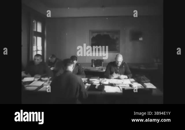 SWITZERLAND - 1939 - Swiss military officials view a map during a ...