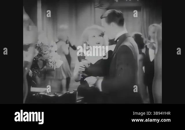 USA - 1928 - In this silent film, a woman (Clara Bow) encourages a ...
