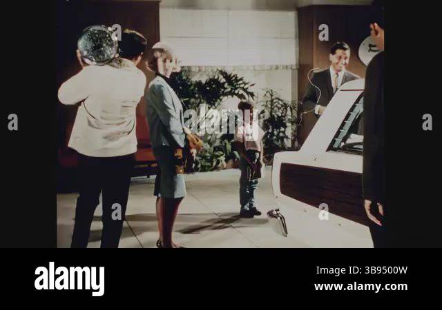 USA - 1966 - In this vintage car commercial, a man shows off the door ...