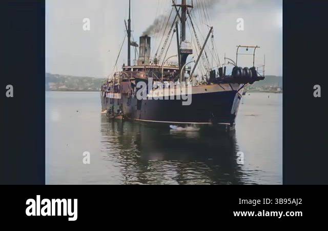 CANADA - 1912 - A lifeboat is hoisted aboard the cable ship Mackay ...