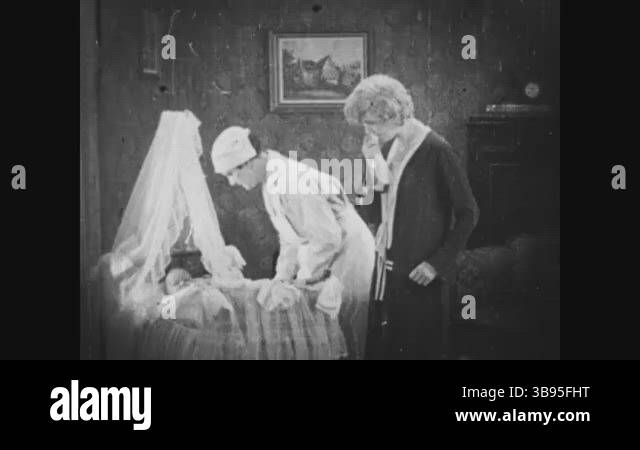 PARIS - 1926 - Daisy looks at her baby with Marcel after childbirth ...