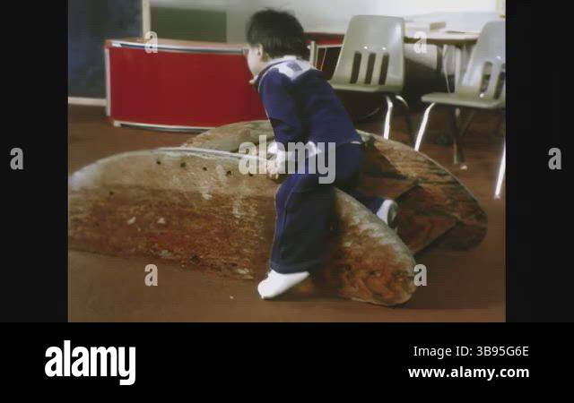 UNITED STATES - 1977 - A boy with Fetal Alcohol Syndrome plays with ...