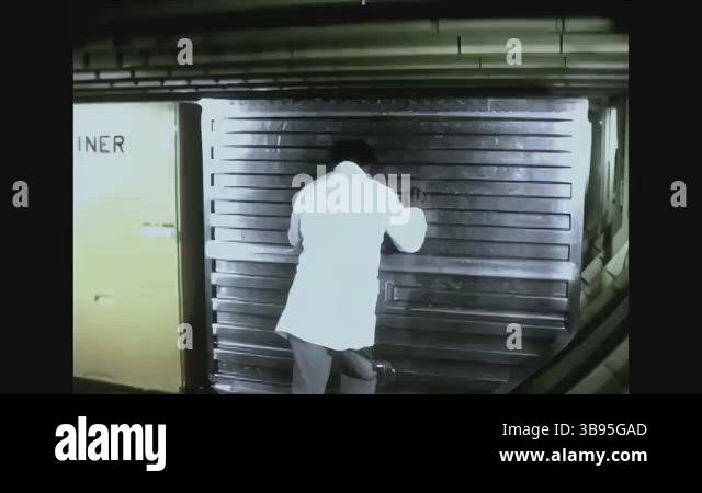 UNITED STATES - 1969 - A scientist pushes containers inside the Boeing ...