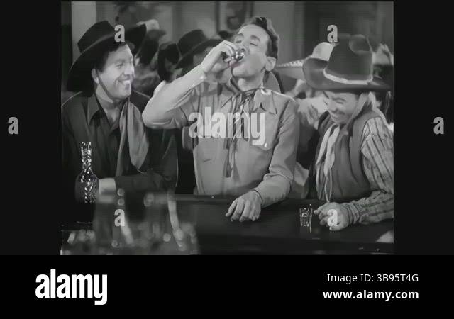 US - 1925 - in this western, three cowboys are having drinks at a bar ...