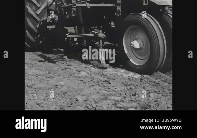 UNITED STATES - 1961 - A planting machine plants the cotton seeds and ...