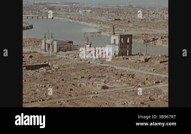 JAPAN - 1945 - A riverfront town in Hiroshima is shown completely ...