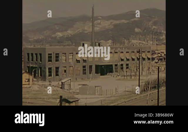 JAPAN - 1945 - A large office building and other public infrastructure ...