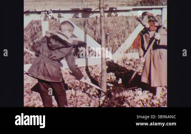 UNITED STATES - 1958 - Jane and Jerry rake leaves with their mother in ...