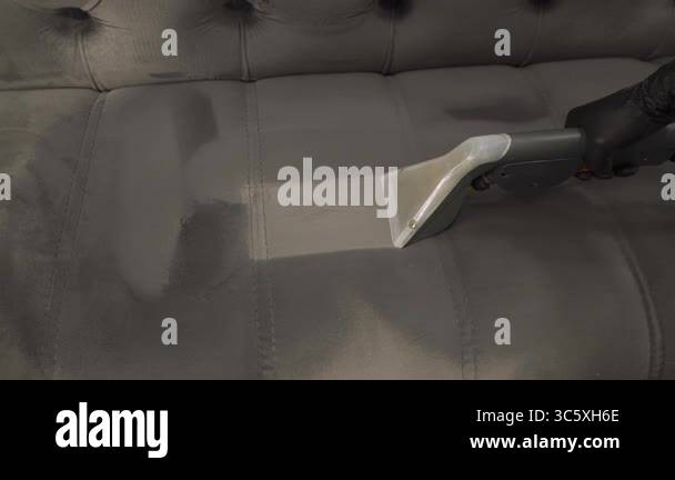 Cleaner is dry-cleaning sofa using extractor machine with detergent 4k ...