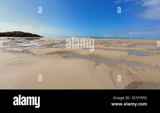 A stunning sandy beach with beautiful tidal patterns, ideal for nature ...