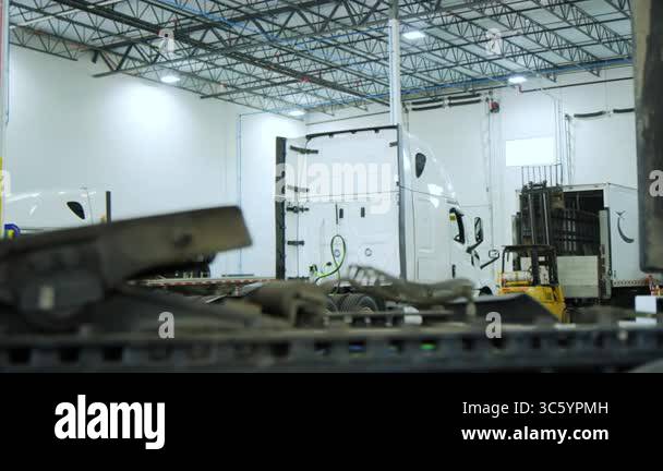The repair shop with trucks waiting to be repaired, Various devices and ...