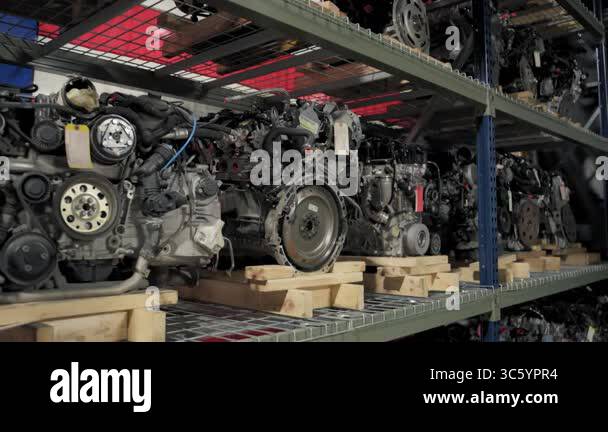 Warehouse interior of OEM used auto parts pile of old car at garage ...