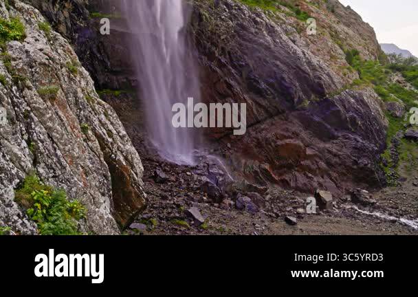 water hits the rocks at the foot of the waterfall, slow motion Stock ...