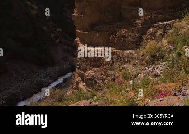 stepped cliff of sedimentary rock at sunny summer day with mountain ...