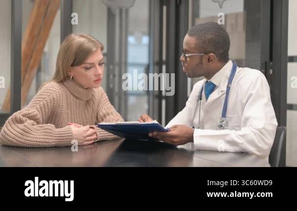 Patient Feeling Happy after Good News by African Doctor, Discussing ...