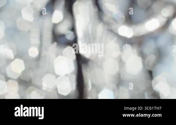 Abstract blurred background with hexagonal bokeh light reflections. Soft focus winter scene with ...