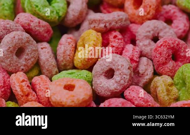 Cereal texture of colored sugary rings slowly rotating very close to ...