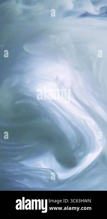 Vertical video. Silk cloud. Smoke swirl. Defocused blue white color ...