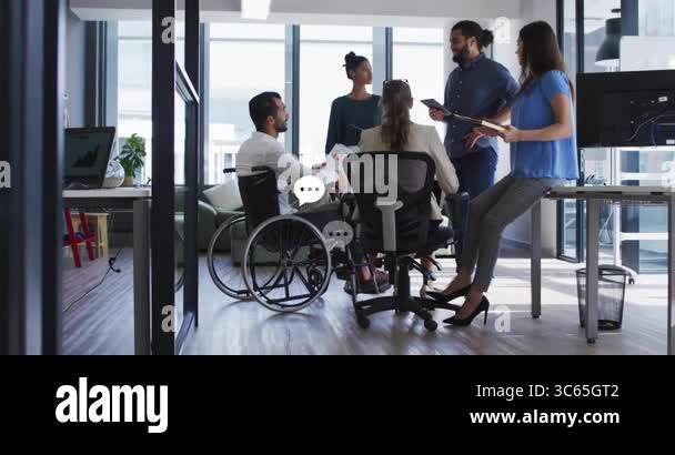 In office, diverse team having animated conversation with speech ...