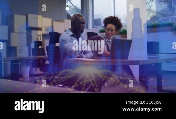 Collaborating at desk, business professionals using animation for ...