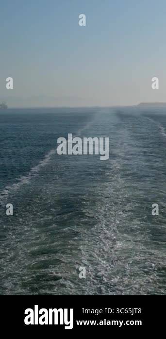 Wake of vessel. Wide wake trail from boat. Back view. Ocean water. Deep ...