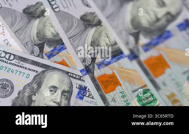 Closeup and detailed view of US hundred dollar banknotes highlighting ...